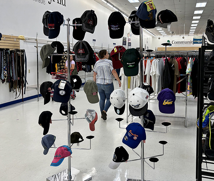 Baseball caps galore, displayed like trophies waiting to crown their next budget-conscious champion with style.
