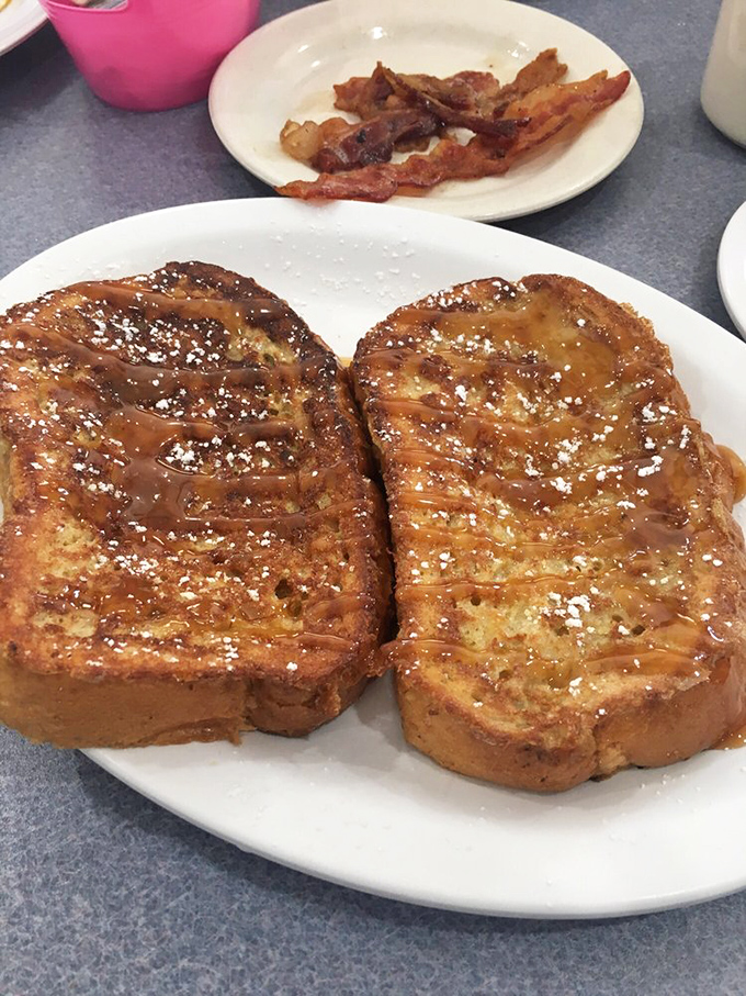 French toast that makes you question every other breakfast decision you've ever made. The powdered sugar isn't decoration&mdash;it's essential punctuation.