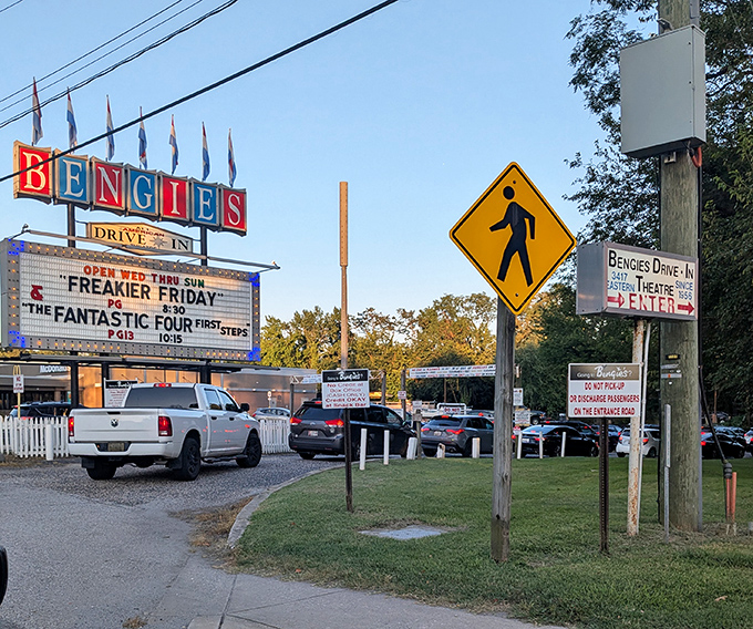 The entrance ritual&mdash;cars forming an anticipatory procession toward celluloid dreams. Everyone remembers their first drive-in pilgrimage.