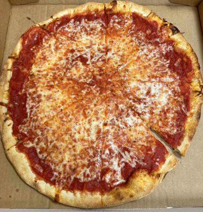 The classic cheese pizza&mdash;proof that perfection doesn't require complexity. That golden-brown crust edge deserves its own fan club.