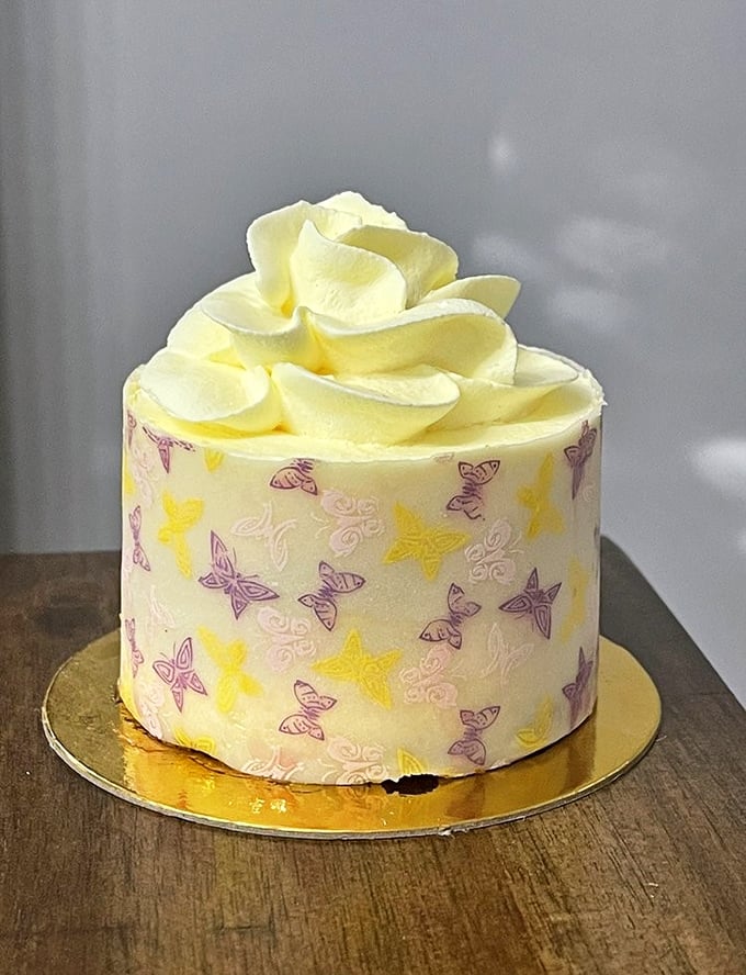 A delicate butterfly-adorned cake that proves vegan desserts aren't just "good enough"—they're works of art that happen to be delicious.
