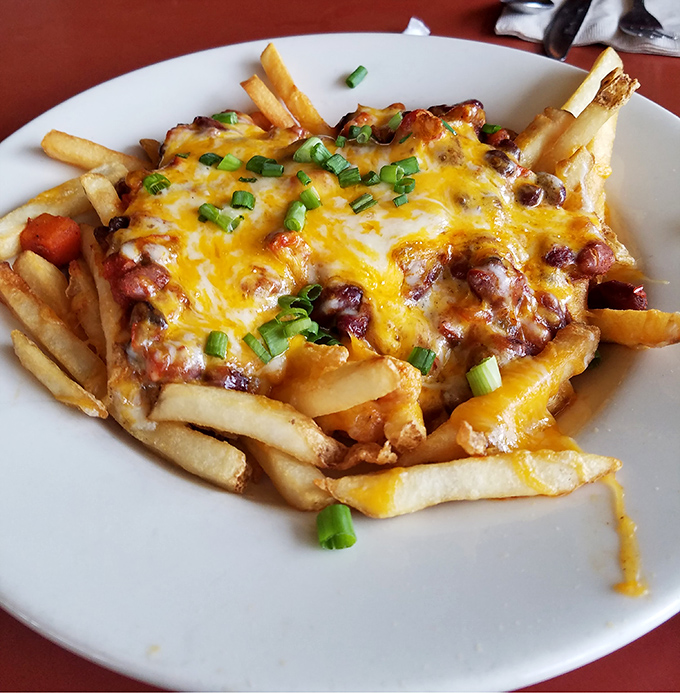 Chili cheese fries that don't apologize for being exactly what they are: a glorious, melty monument to comfort food perfection.