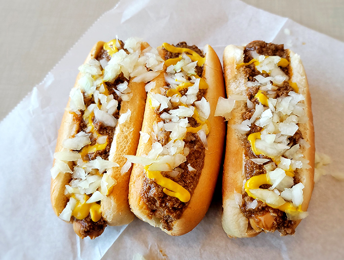 Chili dogs that would make a food snob reconsider their life choices. Simple, messy perfection that requires at least three napkins and zero pretension.