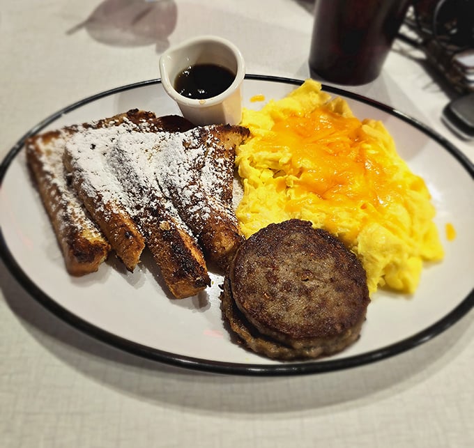 Breakfast that doesn't just start your day but celebrates it&mdash;French toast dusted with powdered sugar alongside eggs that practically glow.