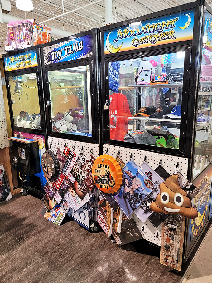The claw machines and toy dispensers stand like sentinels of childhood joy, complete with the emoji pillow that perfectly summarizes flea market emotions.