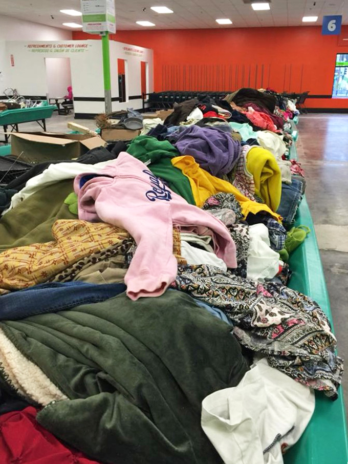A textile mountain range stretches across the horizon of green bins, each peak and valley hiding potential wardrobe revolutions.