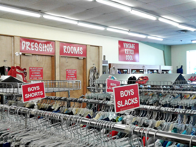 The clothing racks stretch into the distance like a fabric rainbow promising affordable style adventures ahead.