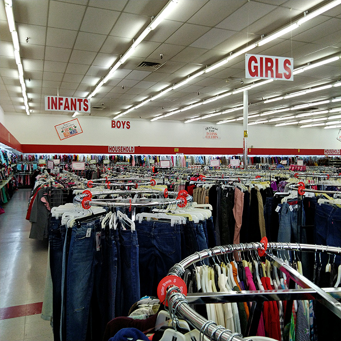 Department store organization meets garage sale prices in the clothing section, where clear signage guides shoppers through a sea of possibilities.