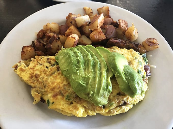 An omelet that's been given the California treatment &ndash; avocado slices fanned out like they're auditioning for a food magazine.