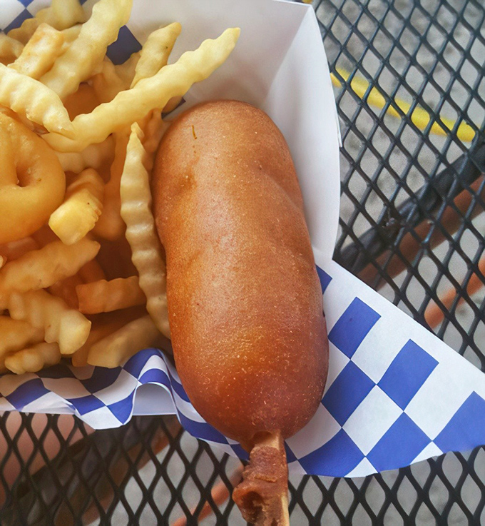The corn dog: America's contribution to food-on-a-stick technology, perfected at roadside stands where nostalgia is always the secret ingredient.