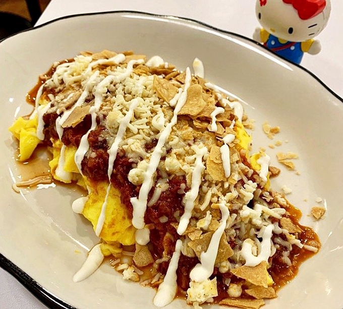 Breakfast reimagined&mdash;eggs meet chili, tortilla chips, and a drizzle of sauce in this morning masterpiece that makes alarm clocks worthwhile.