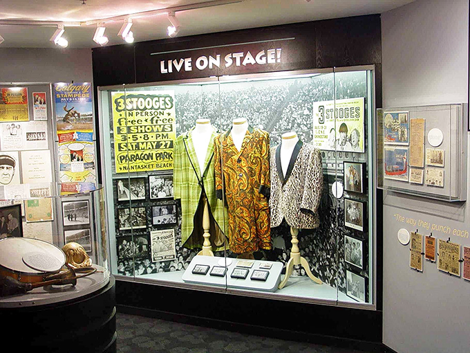 The "Live on Stage" exhibit showcases original costumes and promotional materials from when the Stooges performed their madcap routines for live audiences.