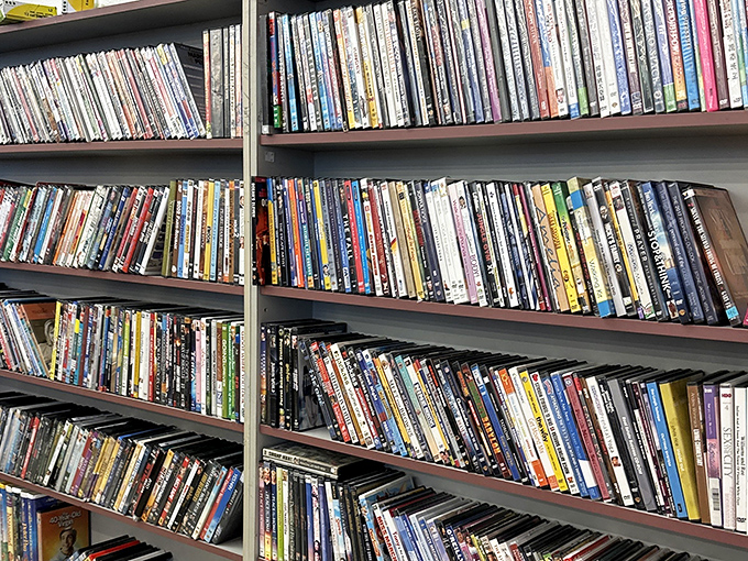 The DVD wall &ndash; a physical Netflix from another era where browsing meant actually touching the cases and reading the backs.