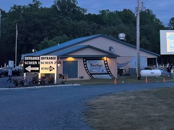 The entrance sign promises two screens of entertainment, because one movie was never quite enough.