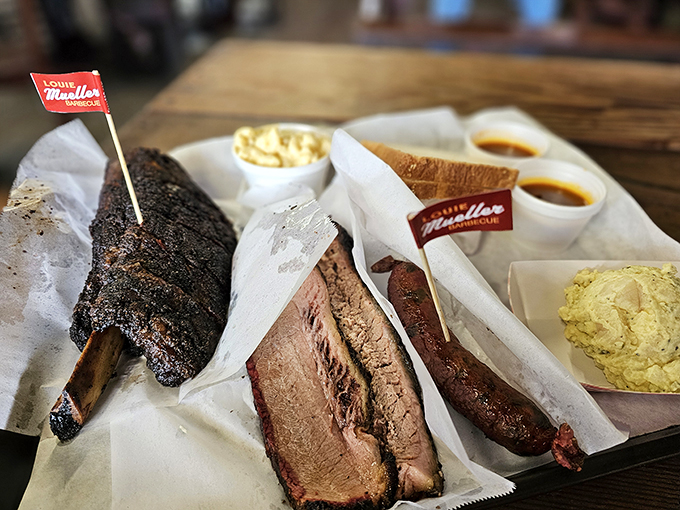 Not so much a meal as a declaration of carnivorous intent. This tray represents hours of smoking expertise and generations of Texas barbecue wisdom.