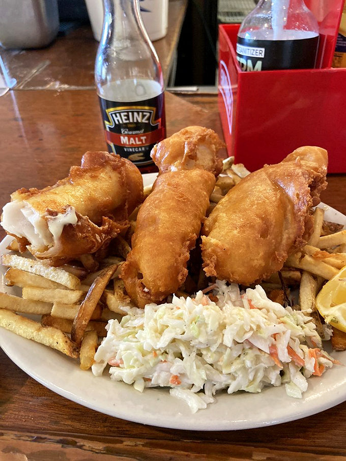 The star of the show: golden-battered Lake Erie perch that shatters with each bite, served with crispy fries and coleslaw that isn't an afterthought.
