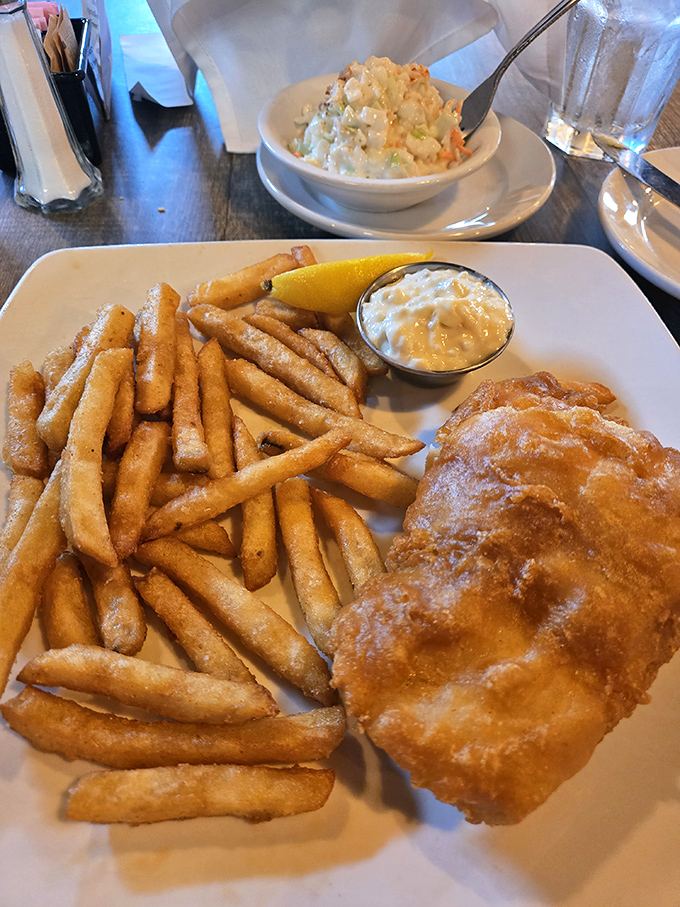 Fish and chips with a side of coleslaw &ndash; comfort food that crosses international waters. That golden batter is what dreams and cheat days are made of.
