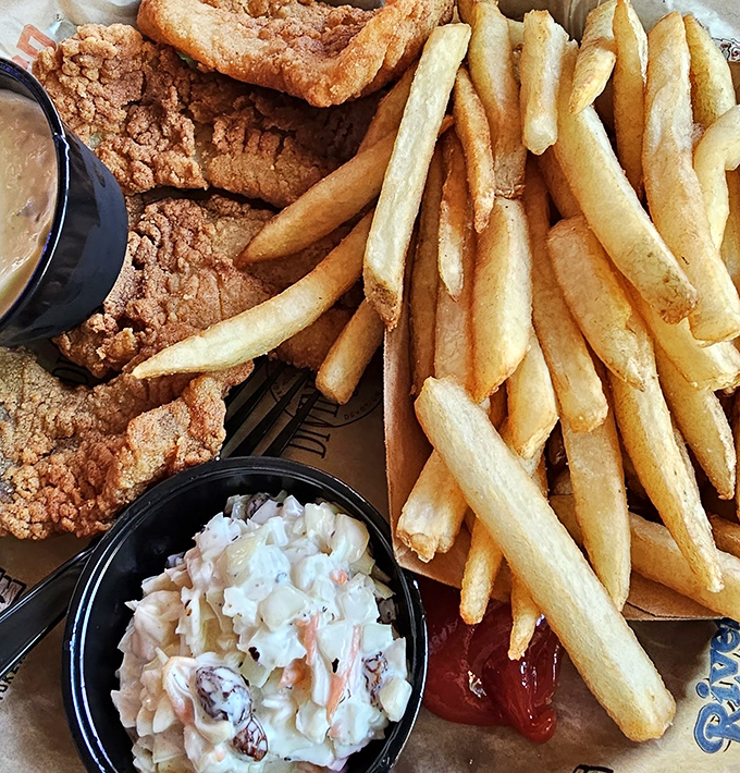 Golden fries, crispy fish, and homemade coleslaw&mdash;the holy trinity of beach comfort food that tastes like vacation on a plate.