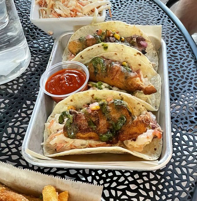 Fish tacos that make you question why you ever lived anywhere without them. The perfect marriage of crispy, creamy, and tangy in every bite.