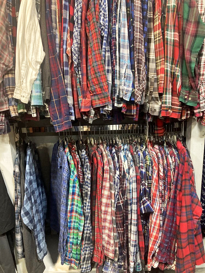 Flannel shirts hang like fabric time capsules, each pattern telling stories of campfires and cozy mornings.