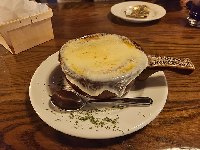 The French onion soup arrives like a warm hug in a crock&mdash;a bubbling blanket of melted cheese concealing a rich, beefy broth that's worth every potential chin dribble.
