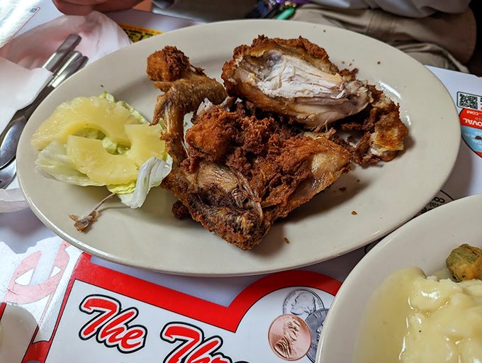 Golden-brown fried chicken that makes you wonder why anyone bothered inventing molecular gastronomy when perfection was already achieved.