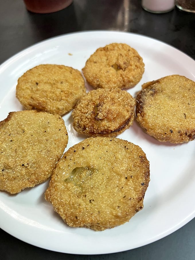 Perfectly golden fried green tomatoes that achieve the impossible balance of crispy exterior and tangy interior &ndash; the unsung heroes of Southern appetizers.