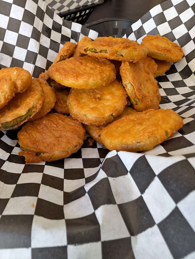Golden-fried pickle medallions that would make even pickle skeptics reconsider their life choices. Crispy, tangy perfection.