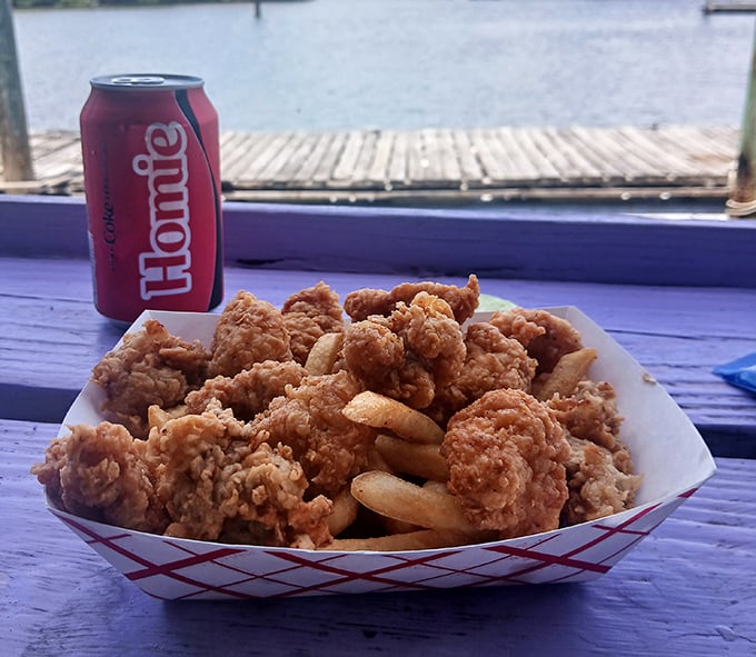 Fried shrimp and fries with a waterfront view. Some might call it basic; I call it perfection in a red-checkered basket.