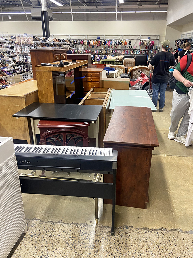 The furniture section resembles a time-traveling living room where mid-century modern meets yesterday's IKEA, with that piano whispering "take me home."