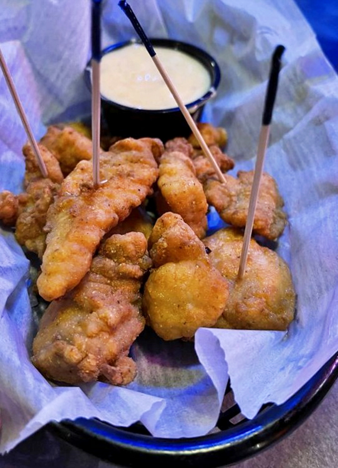 Crispy nuggets of goodness served with dipping sauce that makes you forget you're eating something that could've once eaten you.