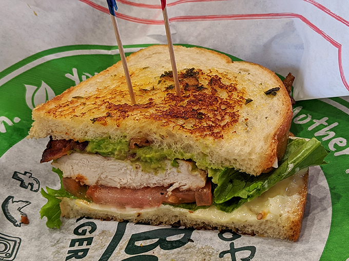 A sandwich that requires both hands and several napkins is always a good sign. This grilled chicken creation delivers crunch, freshness, and satisfaction.