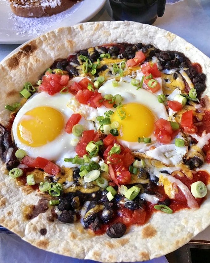 Huevos Rancheros that dance on the plate&mdash;sunny eggs, black beans, and fresh tomatoes creating a fiesta worth waking up for.