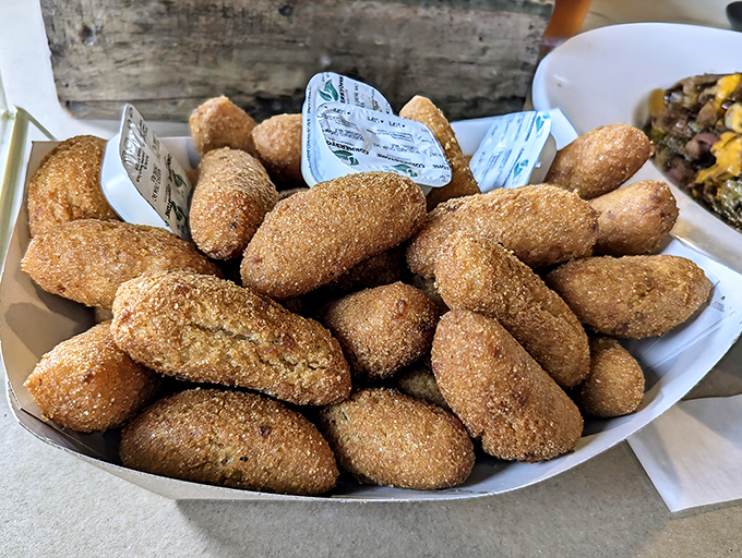 Hush puppies so golden and perfect, they make Southern grandmothers nod in approval. Crispy outside, tender inside&mdash;the ideal seafood sidekick.