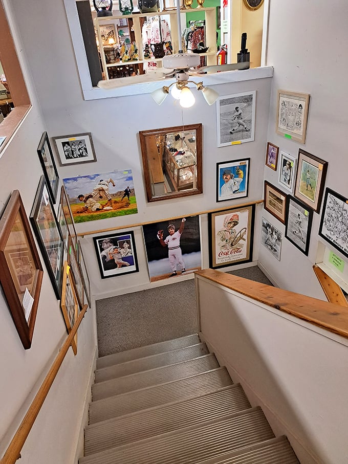 Baseball memorabilia lines the stairway, where sports legends of yesteryear keep watch over treasure hunters ascending to new discoveries.