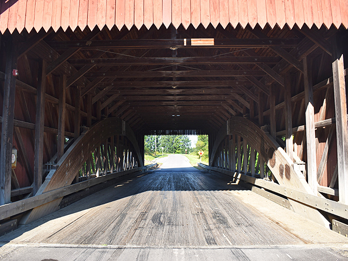 Step inside and you're transported to another era, where wooden beams create a cathedral-like passage across the water below.