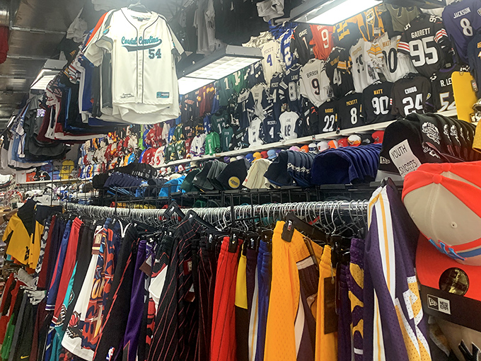 Sports jersey heaven where fans can represent their teams without representing their entire paycheck. A rainbow of athletic allegiances hanging in perfect harmony.