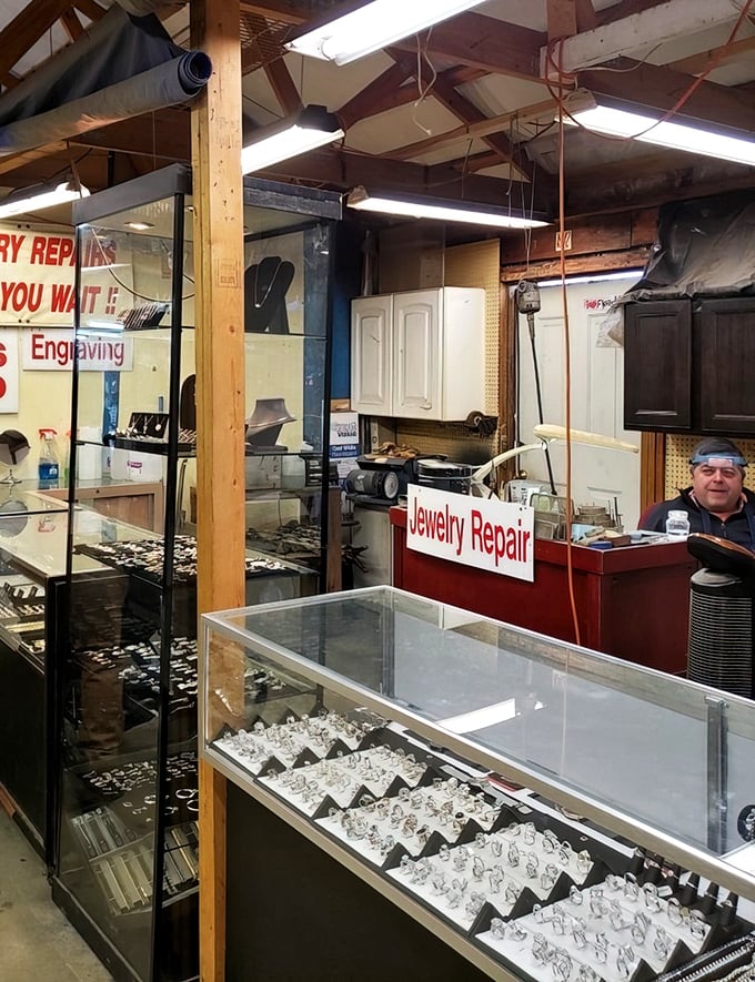 "Jewelry repair while you wait" promises the sign, where family heirlooms get new life. This craftsman has likely heard thousands of stories behind the pieces that cross his counter.