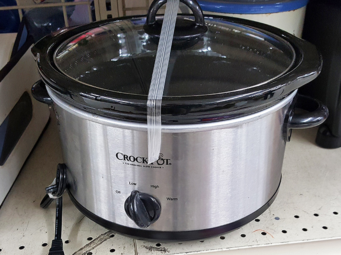 A barely-used Crock-Pot waits patiently for its second chapter. Someone's abandoned kitchen helper is about to become another family's Sunday dinner hero.