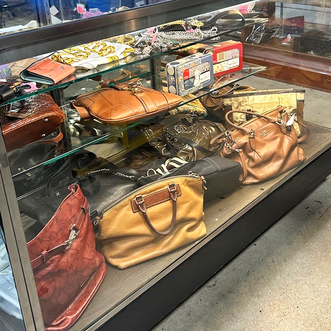 Handbag heaven behind glass&mdash;where vintage Coach meets contemporary classics. Each one secretly hoping you'll take it to brunch this weekend.