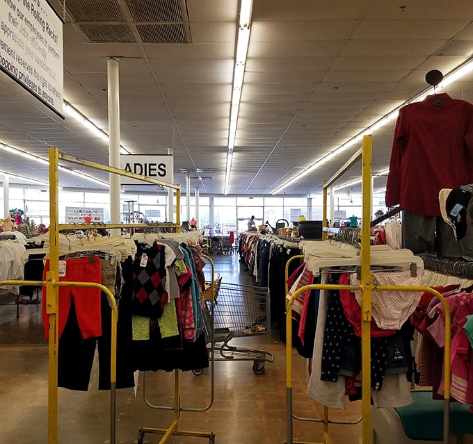 "Ladies" section: where patience rewards the persistent. These color-coded racks contain everything from workwear to wedding guest attire.