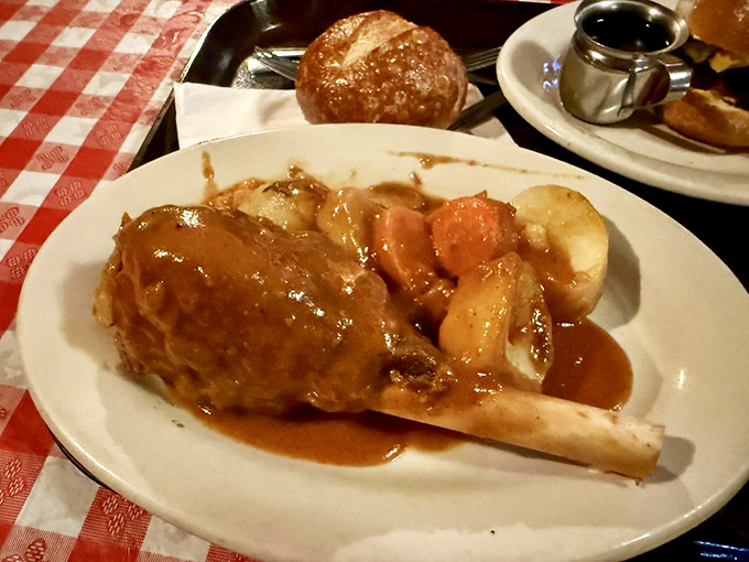 The lamb shank looks like it belongs in a medieval feast scene&mdash;tender meat falling off the bone, swimming in gravy that deserves its own fan club.