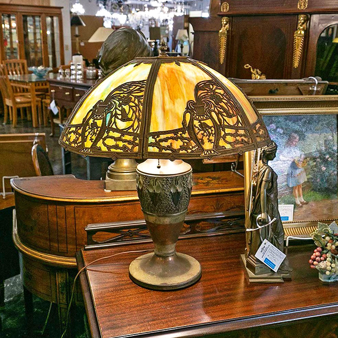 This isn't just a vintage lamp; it's a Tiffany-style storyteller waiting to cast warm, honeyed light across your favorite reading nook.