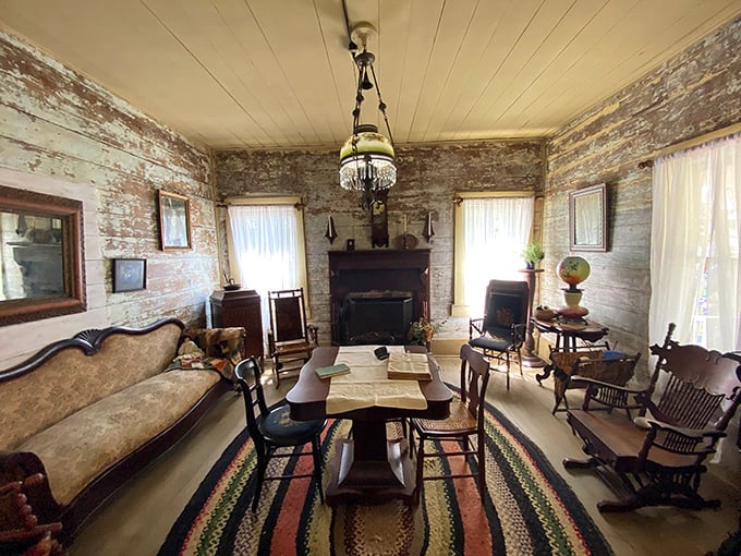 A living room where families actually talked to each other! The braided rug and oil lamps create an atmosphere of simple, genuine togetherness.