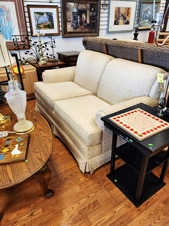 That cream-colored loveseat isn't just furniture&mdash;it's the beginning of your living room's redemption story. The framed artwork behind completes the transformation.