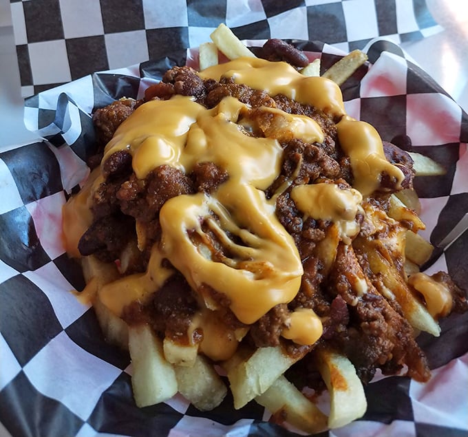 These loaded fries aren't just a side dish&mdash;they're a main event draped in cheese sauce that flows like molten gold.