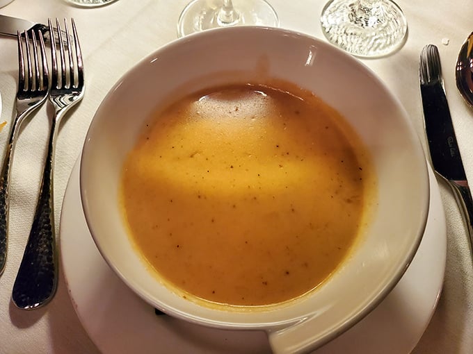 This golden lobster bisque isn't just soup&mdash;it's a warm embrace in a bowl, rich with seafood essence and velvety texture.
