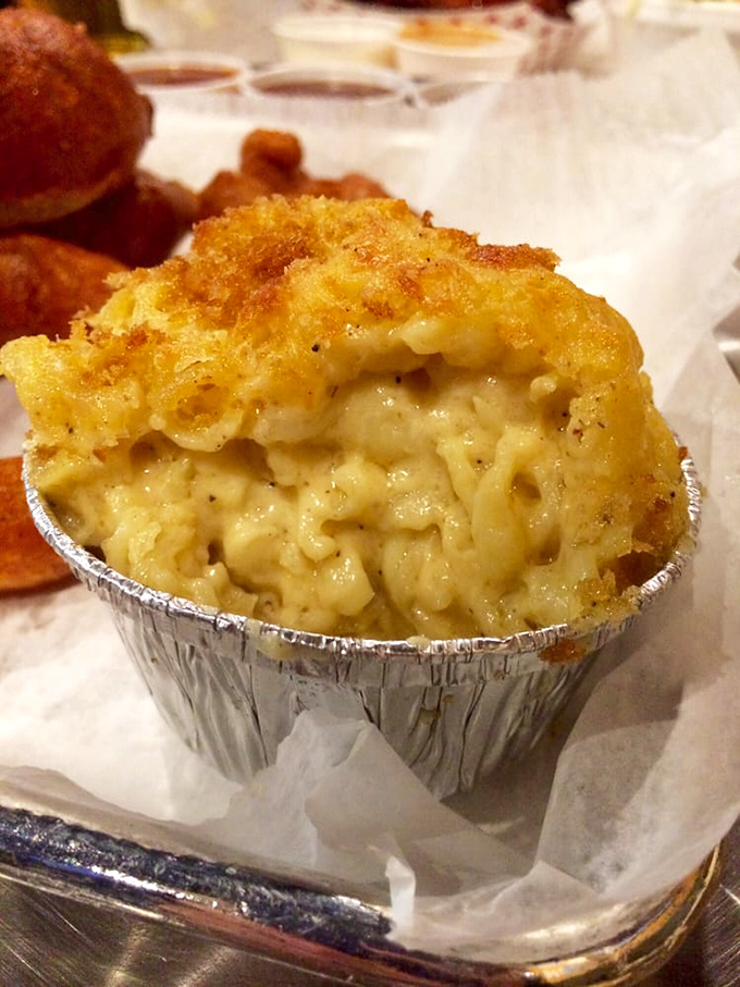 Mac and cheese that's achieved the impossible trifecta: creamy interior, crispy top, and enough character to hold its own against the smokehouse stars.