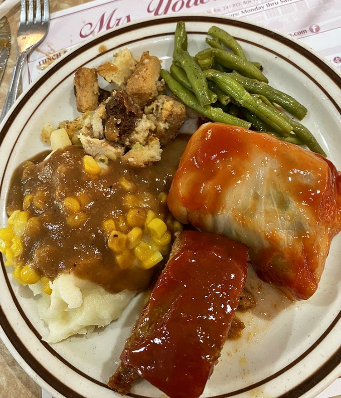 Mashed potatoes swimming in gravy with meatloaf wearing a saucy red jacket&mdash;comfort food that speaks the universal language of "mmmmm."