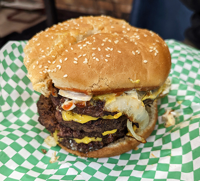 The Monster Cheeseburger lives up to its name. This towering creation isn't just a meal; it's a delicious dare on a sesame seed bun.